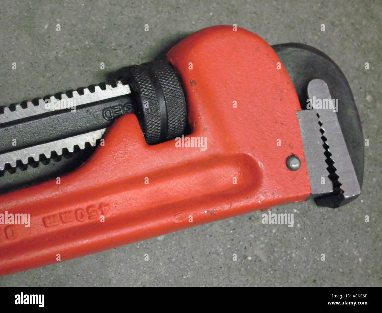 Pipe wrench with a red handle Stock Photo - Alamy