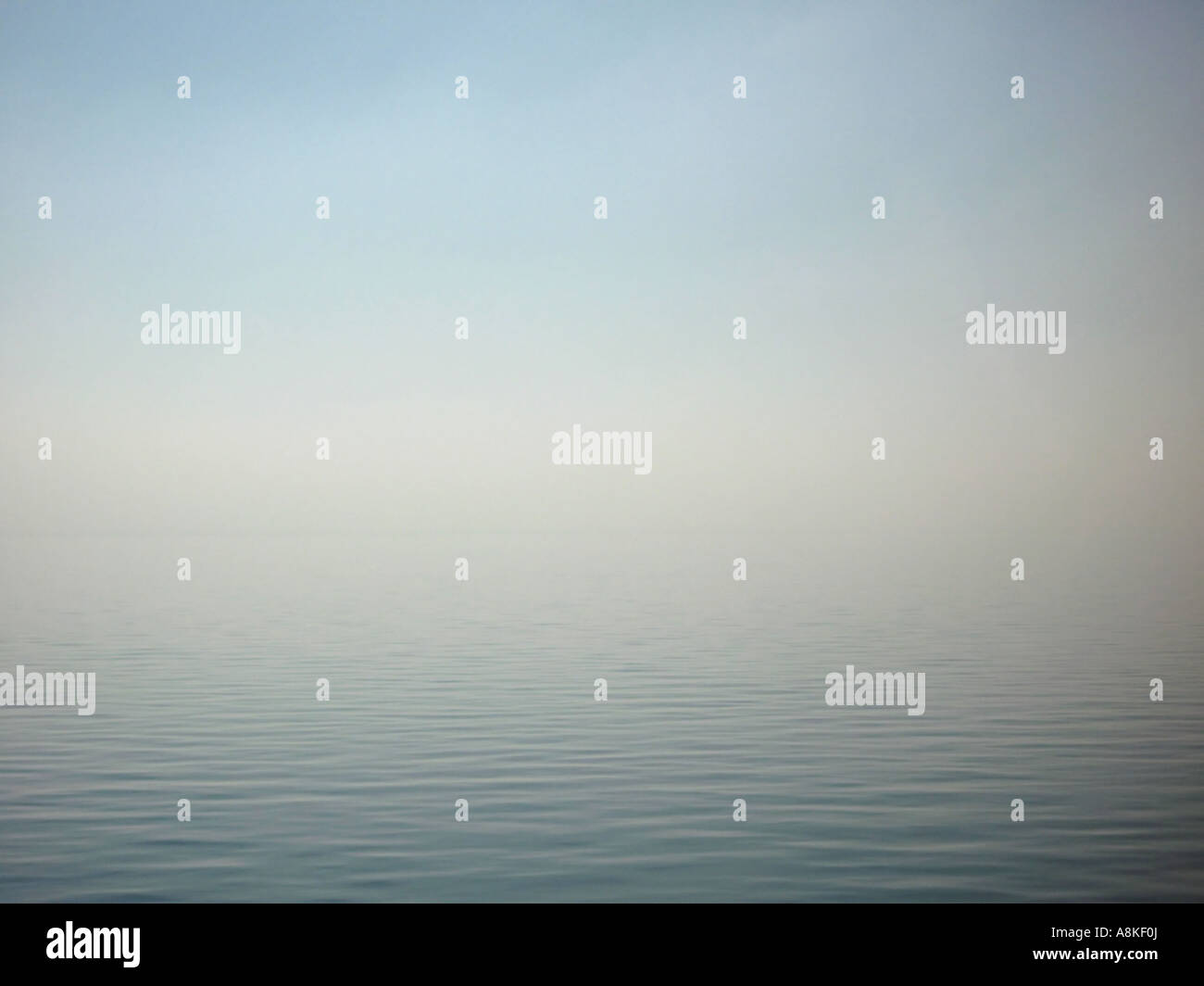 Abstract photo of sky and sea with fog obscuring the horizion in a ...