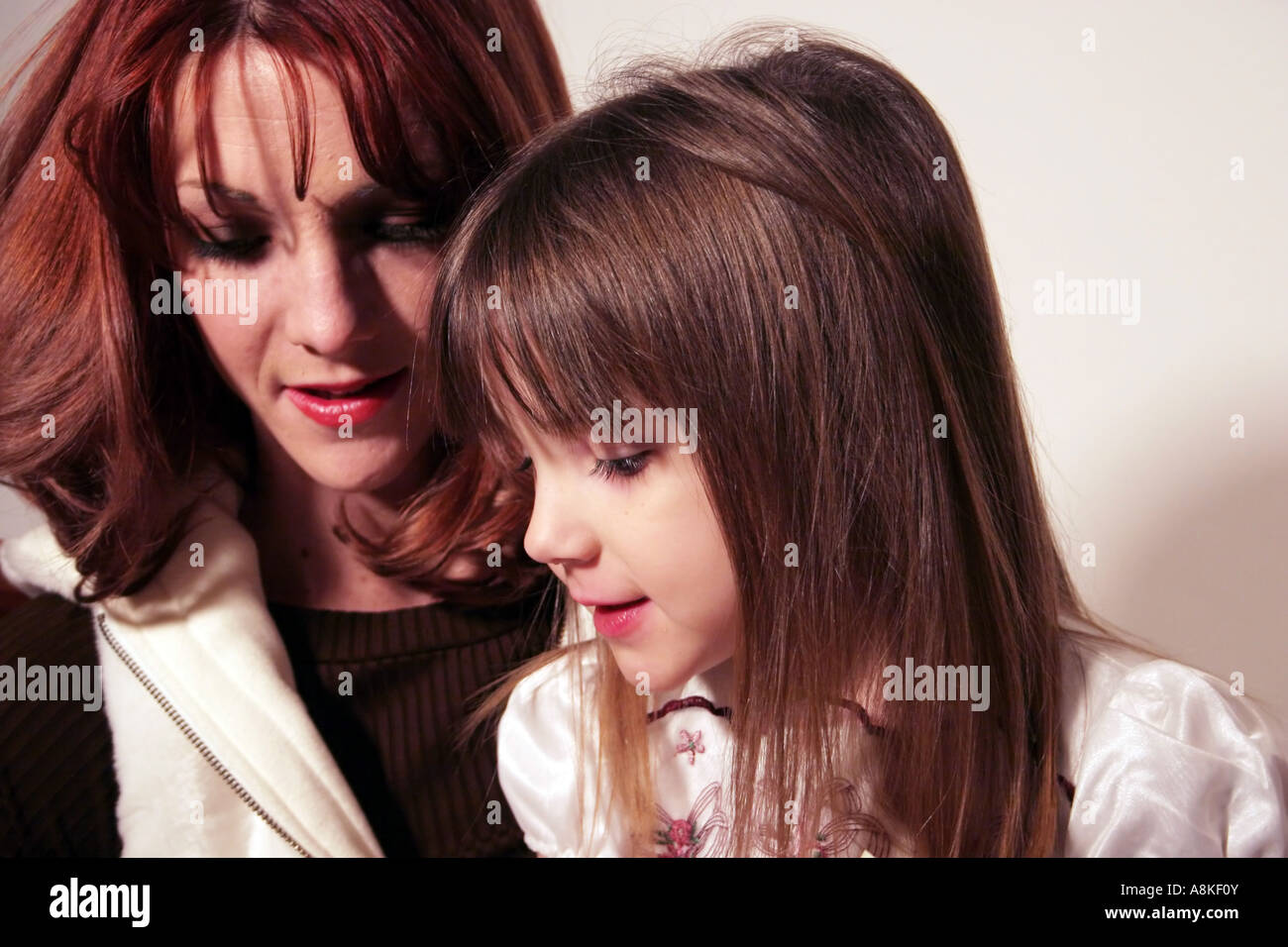 Mother and daughter playing together Stock Photo - Alamy