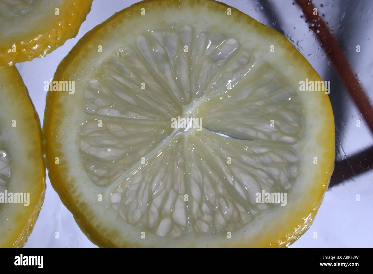 Slice of lemon for drink or cooking Stock Photo - Alamy