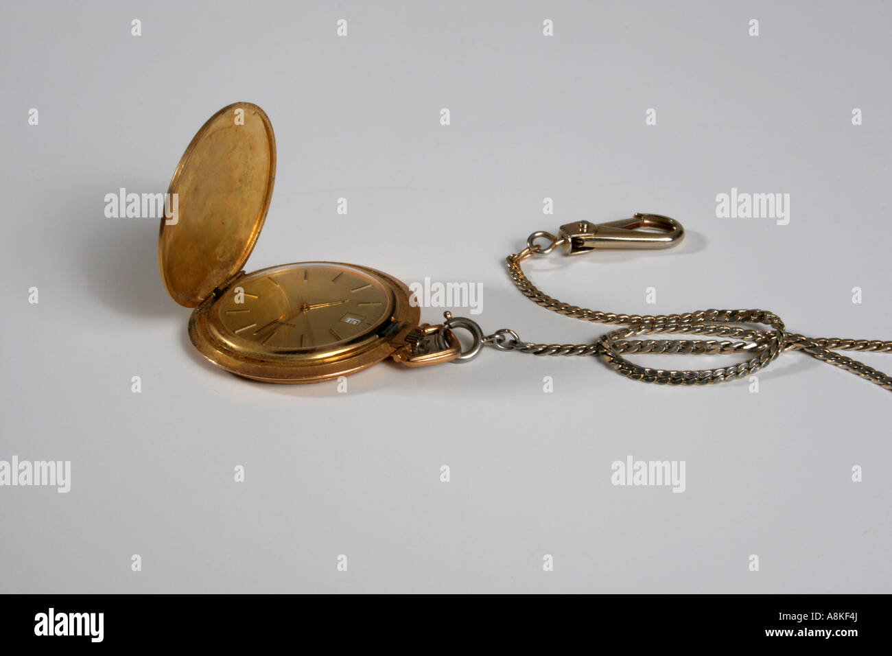 gold Pocketwatch with a chain on a white background Stock Photo - Alamy