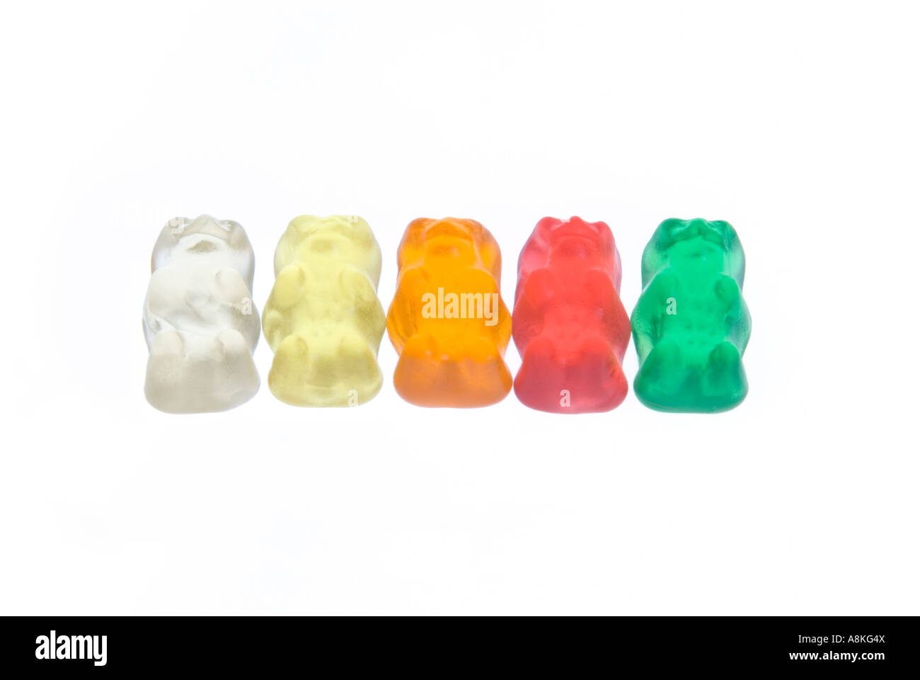 Horizontal close up of a row of five multicoloured gummy bears or teddy ...