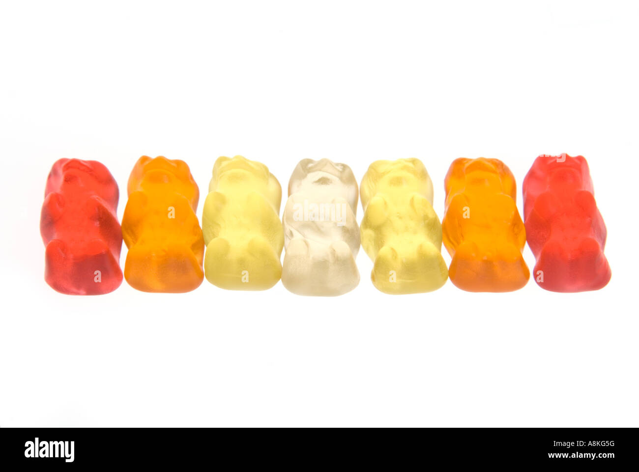 Row of gummi bears on white background hi-res stock photography and ...