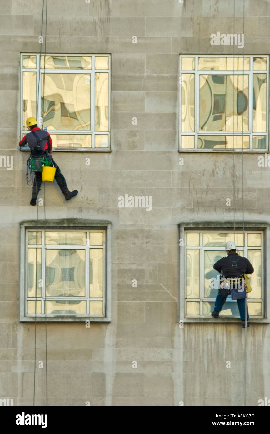Hanging from ropes cleaning windows hi-res stock photography and images ...