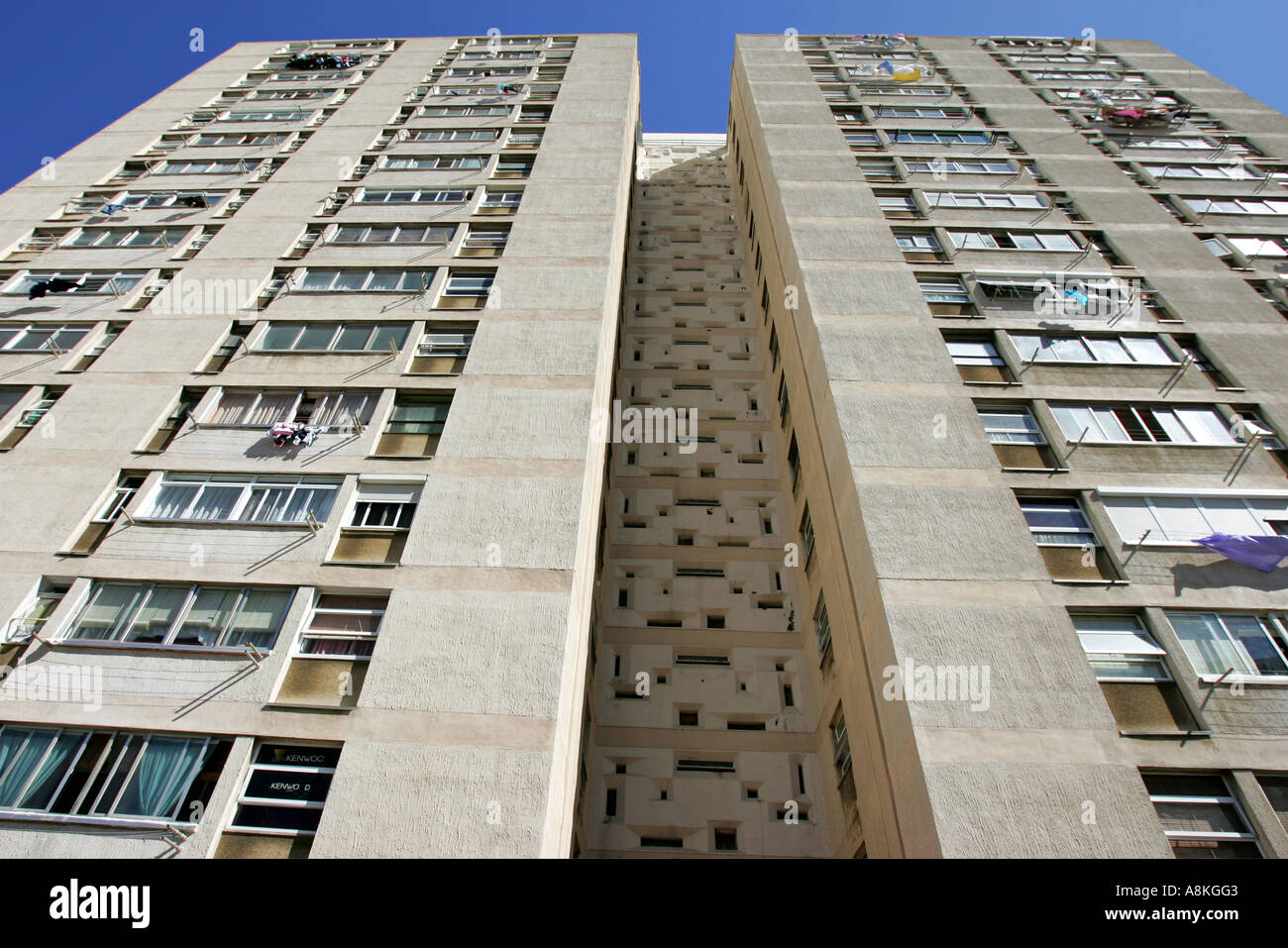 Abstract converging lines of a tall high rise apartment block with many ...