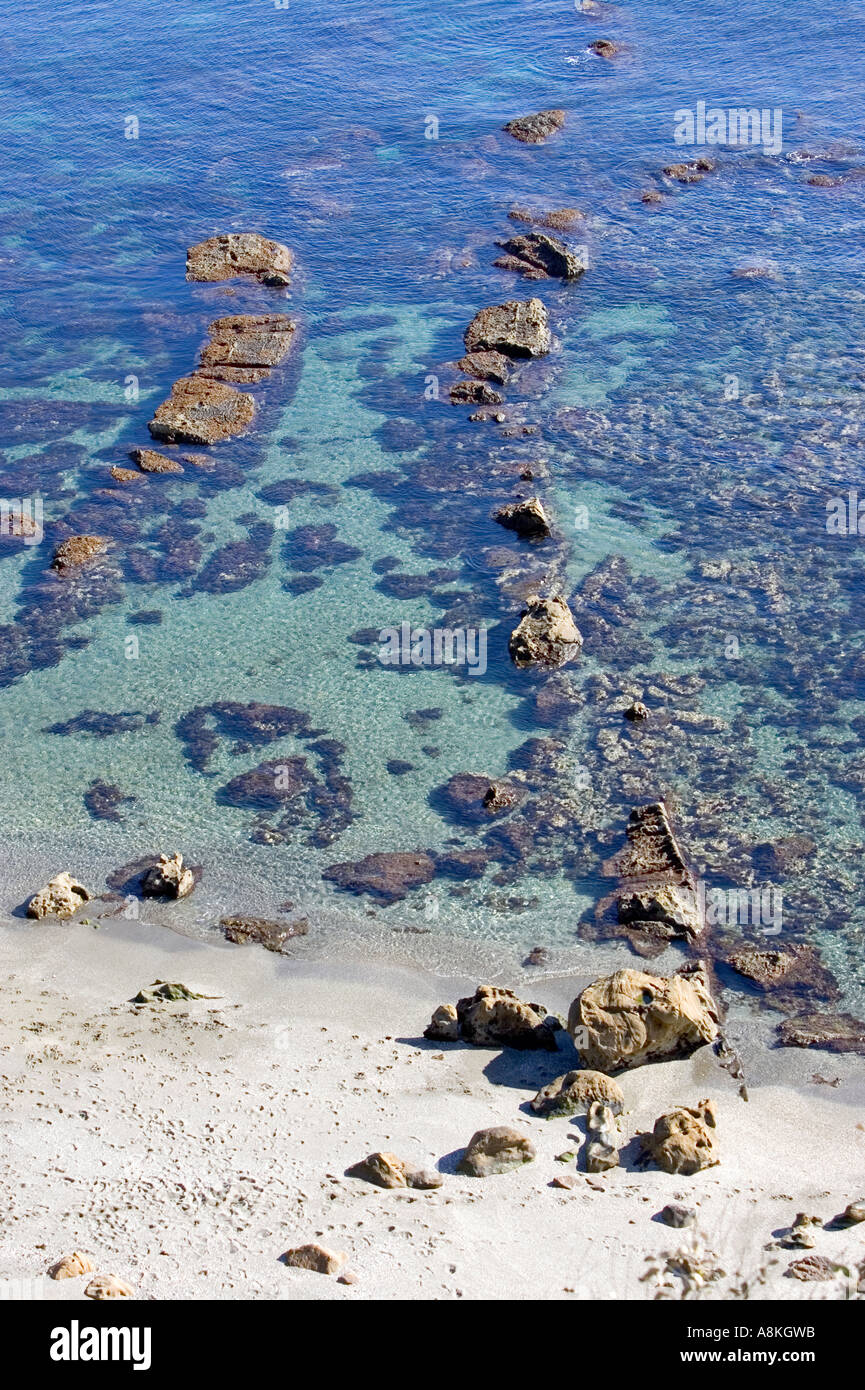 Strange beautiful rock formations in shallow sea on a beach in Spain ...
