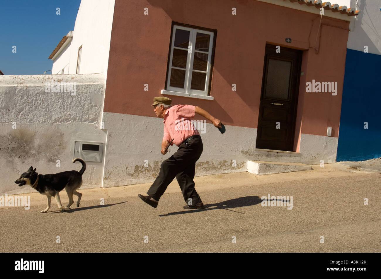 Dog chase man hi-res stock photography and images - Alamy