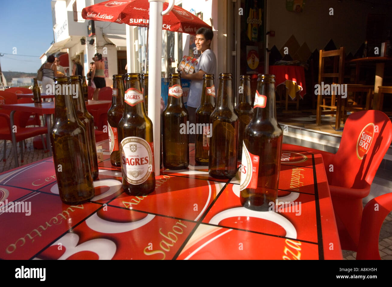 Table of empty beer bottles Aljezur Algarve Portugal Stock Photo - Alamy