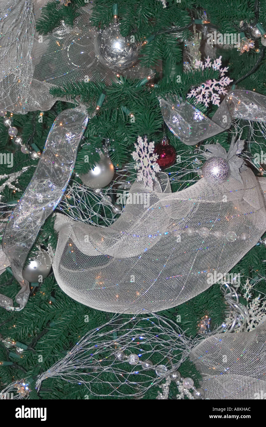 Christmas Tree decorated with silver balls and ribbons Stock Photo - Alamy