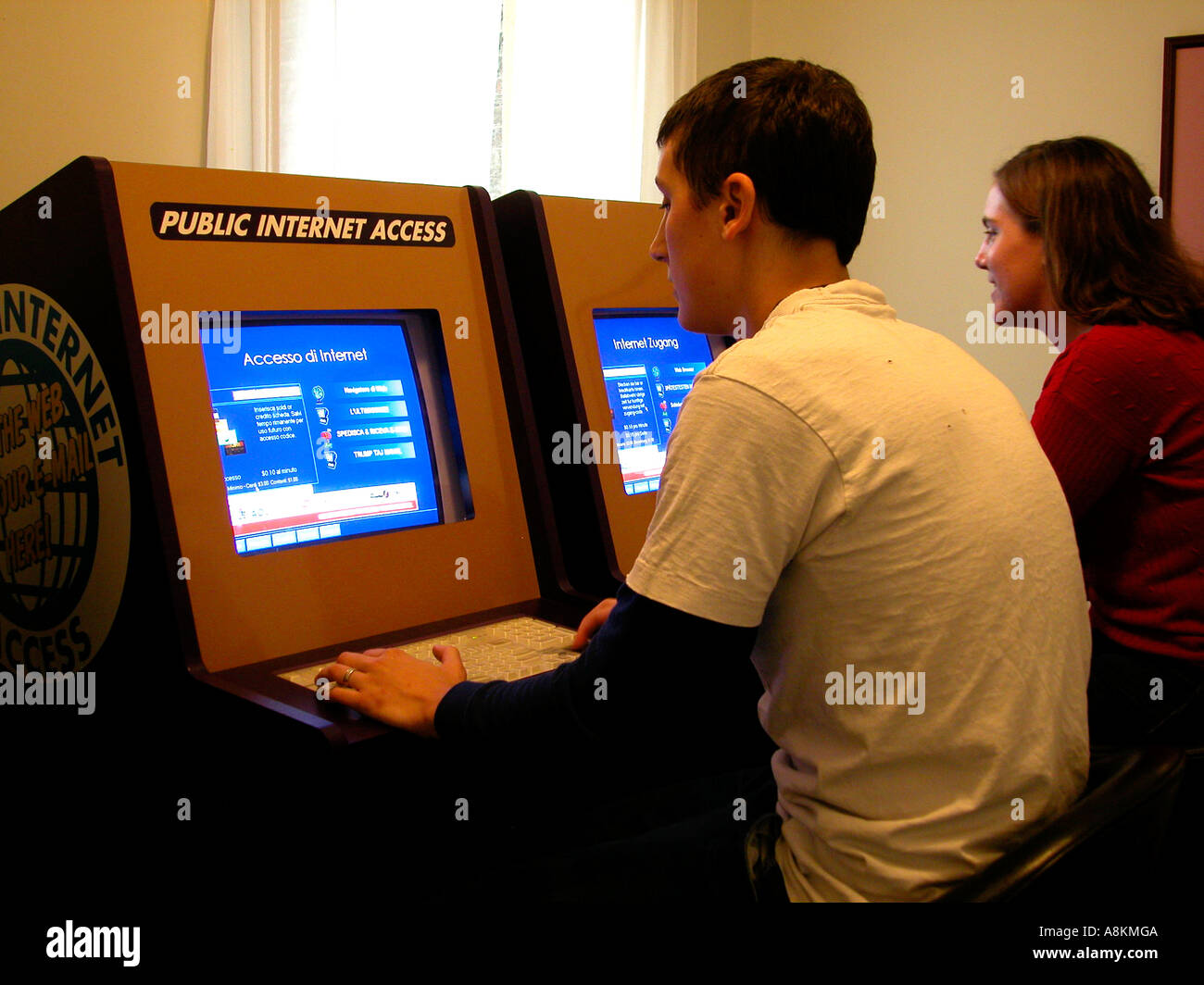 Students using the public internet kiosk at the San Francisco City ...