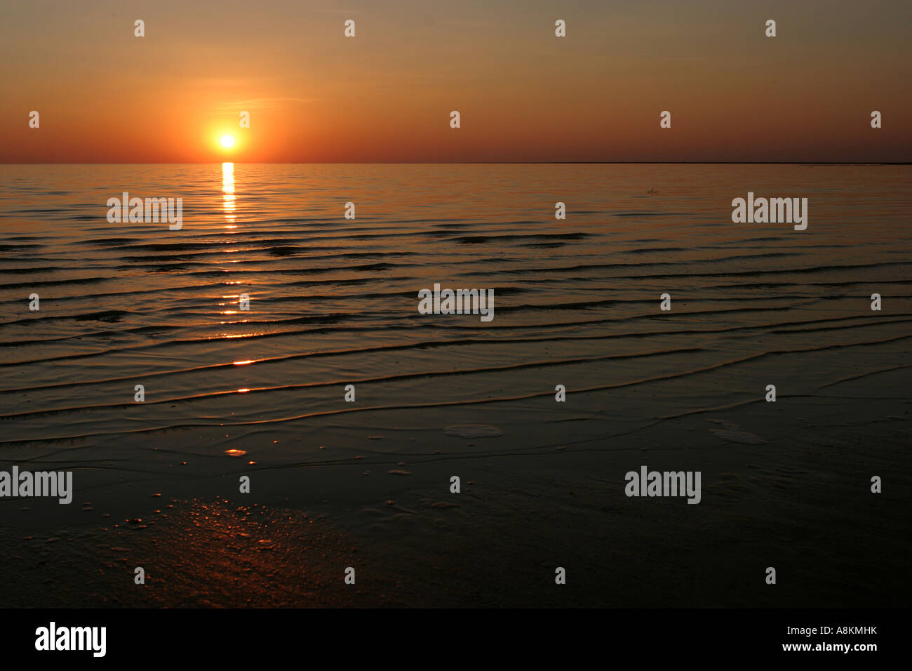 Sunset at the ocean Stock Photo - Alamy