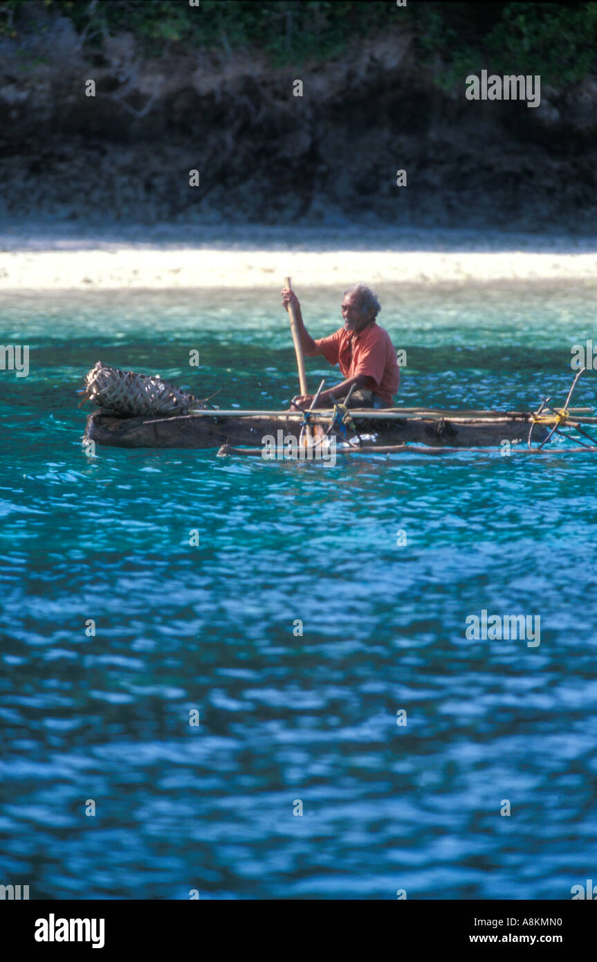 Tongan man paddling traditional wooden handmade fishing canoe Stock ...