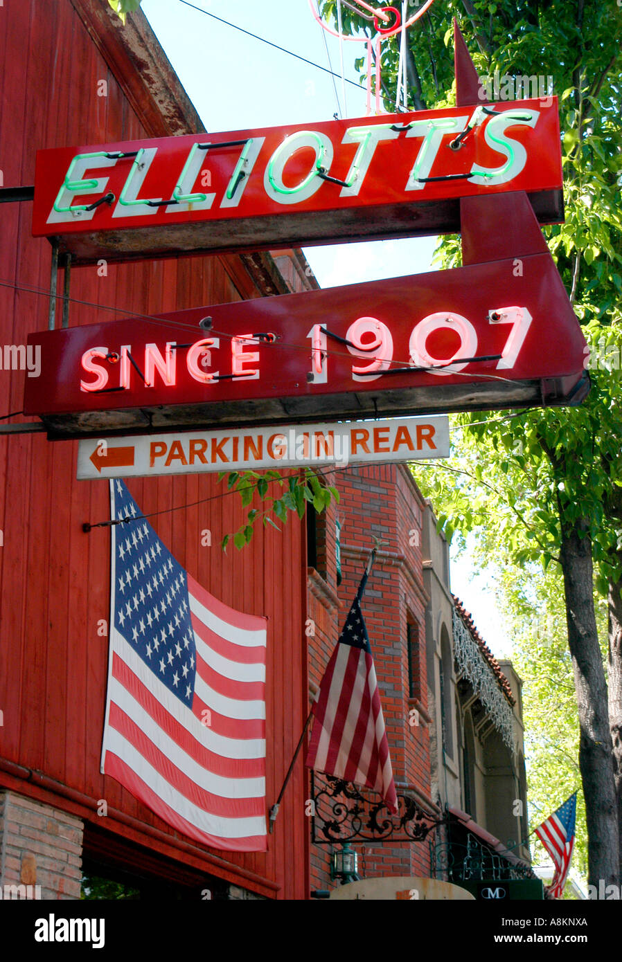 Elliots neon bar sign since 1907 on a small town California street ...