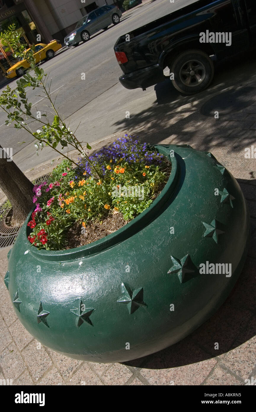 Large iron planter on city sidewalk Stock Photo - Alamy
