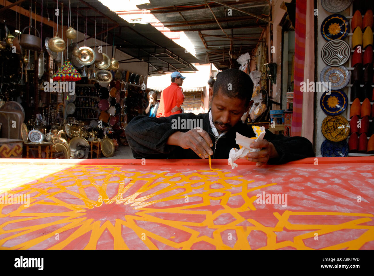 Craftsman painting in souk medina Marrakech Marrakesh Morocco North ...