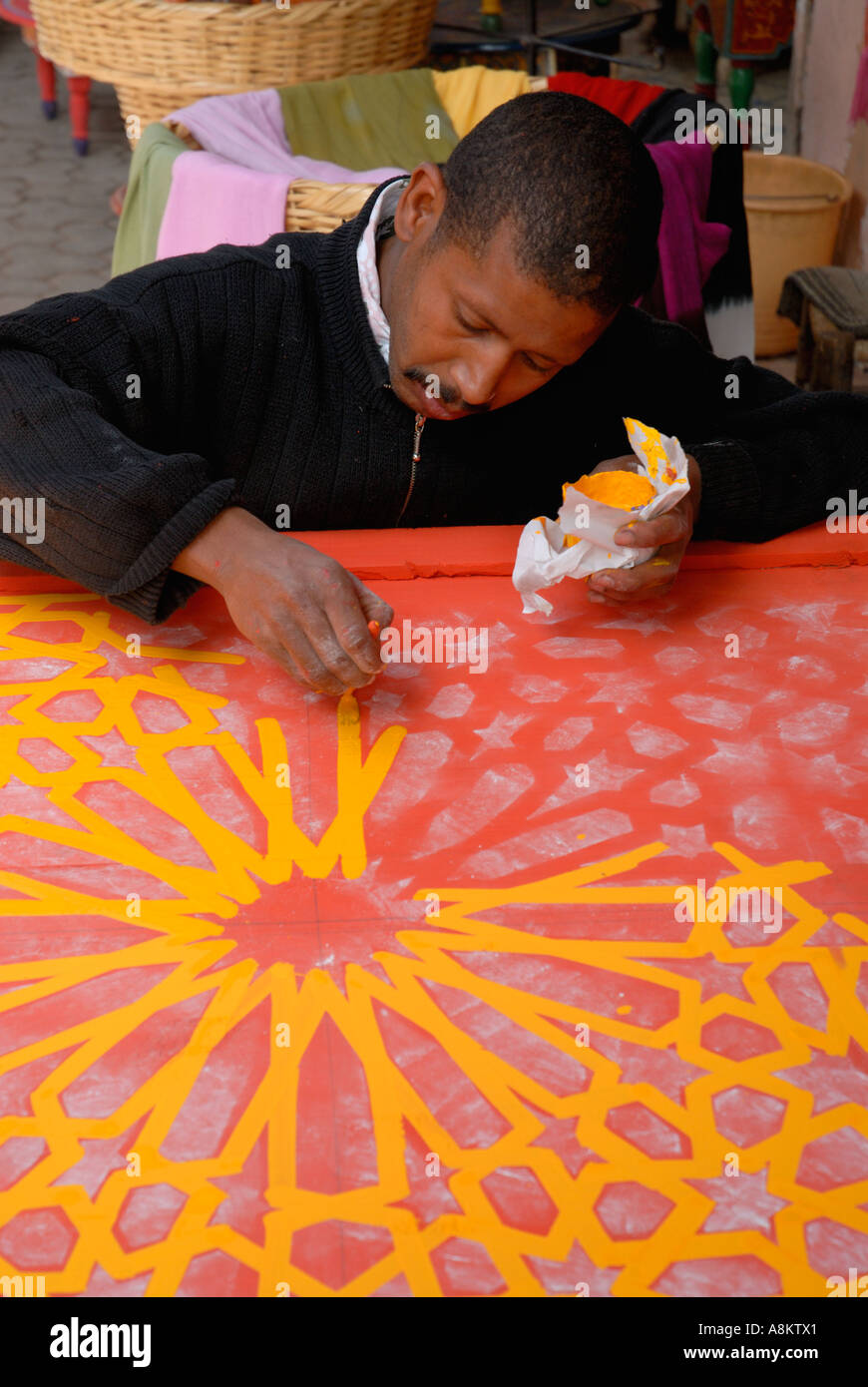 Craftsman painting in souk medina Marrakech Marrakesh Morocco North ...