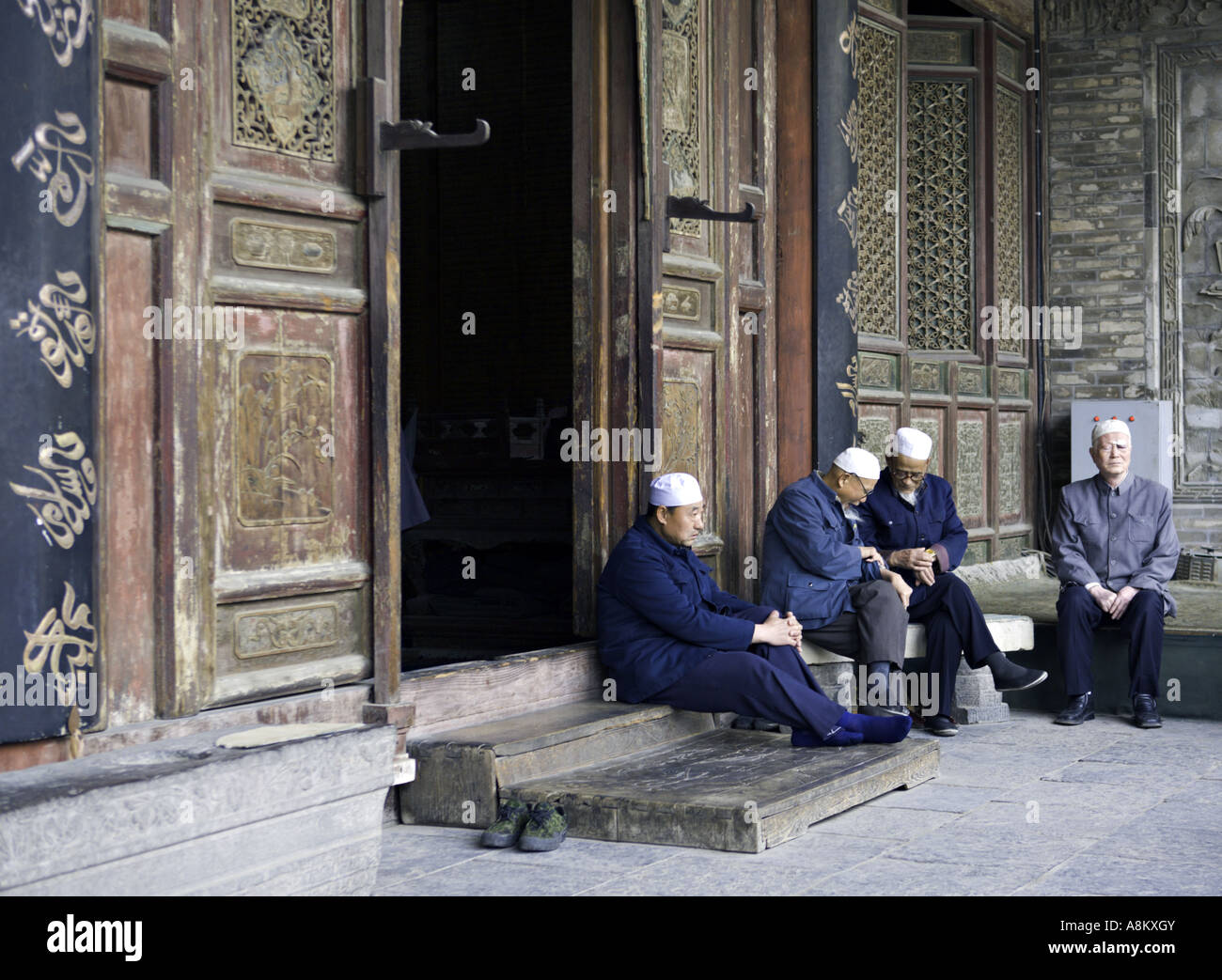 CHINA XI AN Elderly Chinese Muslim men sit outside the elaborately ...