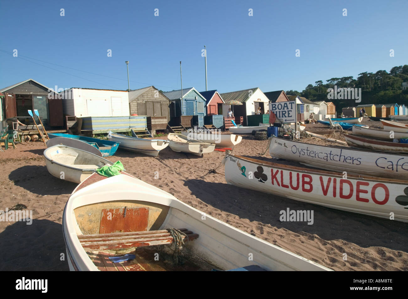 Summer life around beach huts on the Back Beach inside the estuary of ...
