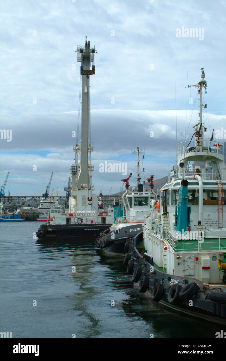 Large Powerful Ocean Going Tug Boat and Floating Crane in Harbour at ...