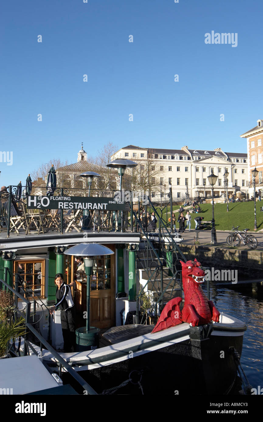 Floating restaurant boat in winter sunshine by Georgian buildings near ...