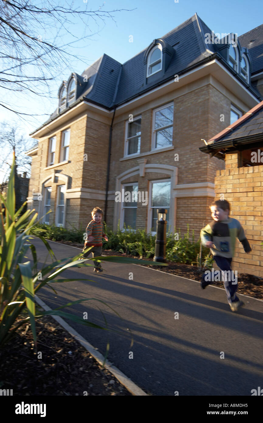 Two young boys children brothers running Stock Photo - Alamy