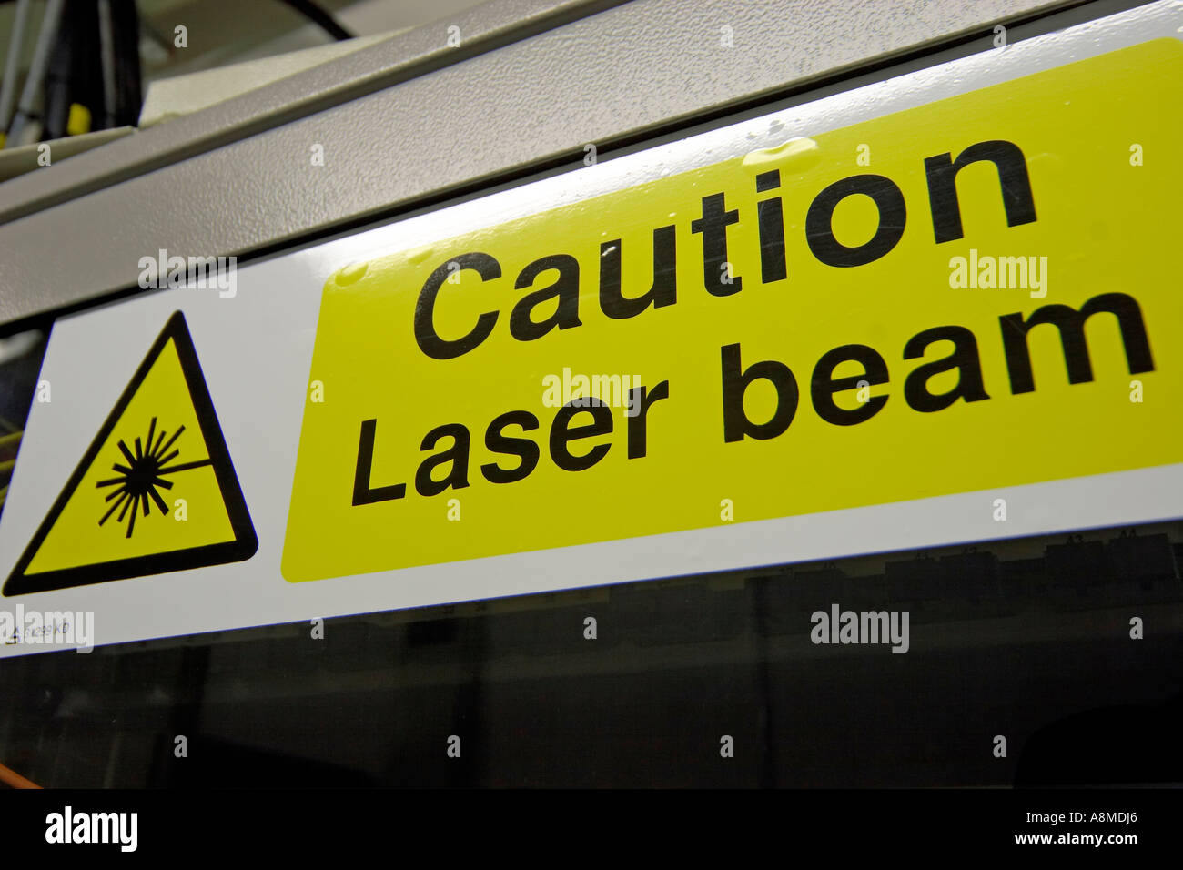 Caution Laser Beam warning sign notice Stock Photo - Alamy