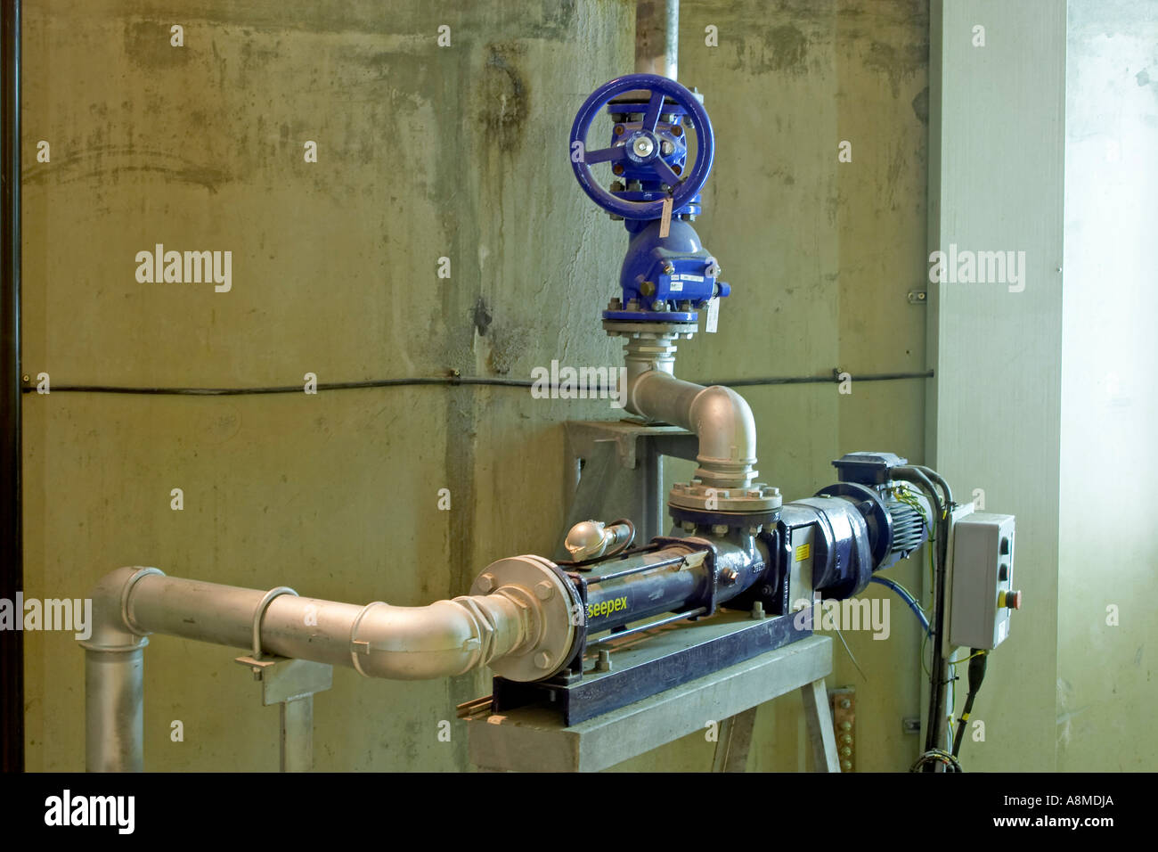 Pipes and valves with electrical controls Stock Photo - Alamy