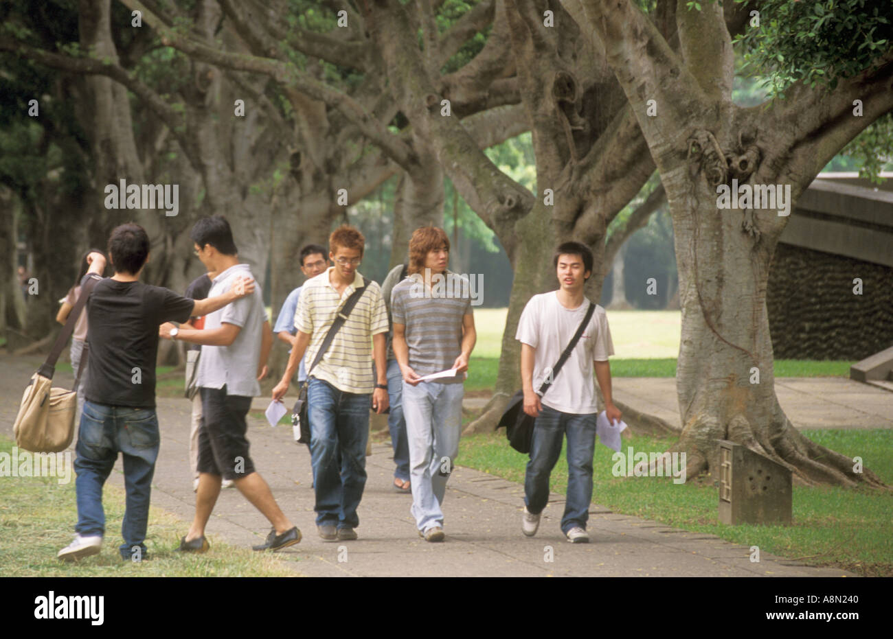 Chinese Asian university students walking on college campus Republic of ...