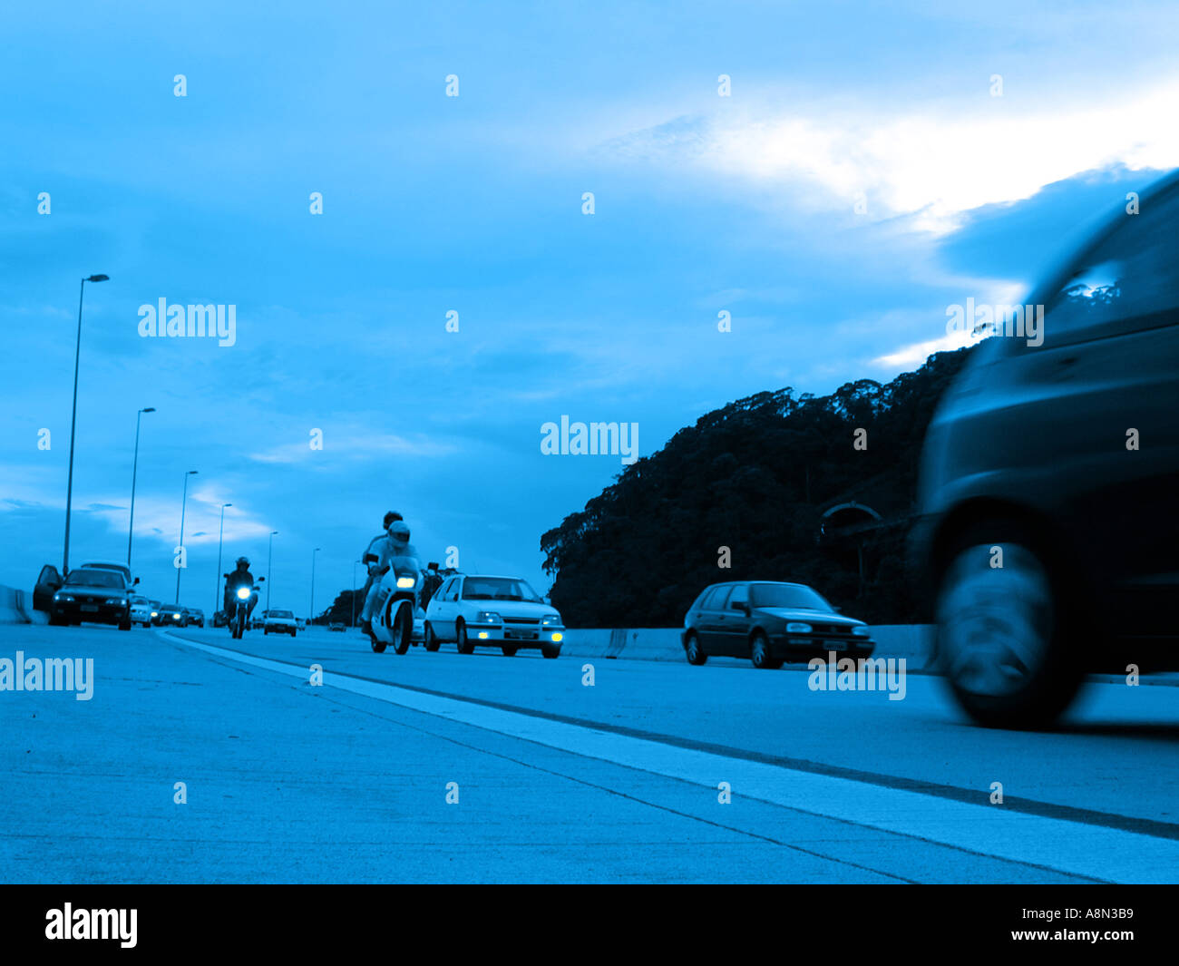 Cars and motorcycles on the highway Stock Photo - Alamy