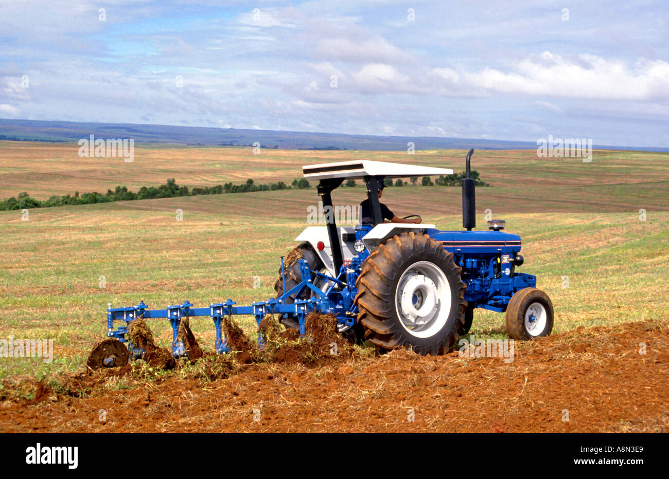 Farmer on tractor Stock Photo - Alamy