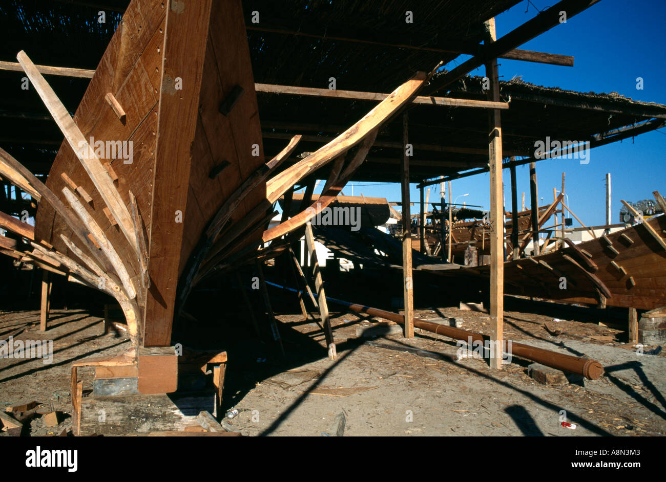 Dhow yard, Sur, Oman. Dhows are built by hand in the yard from wood ...