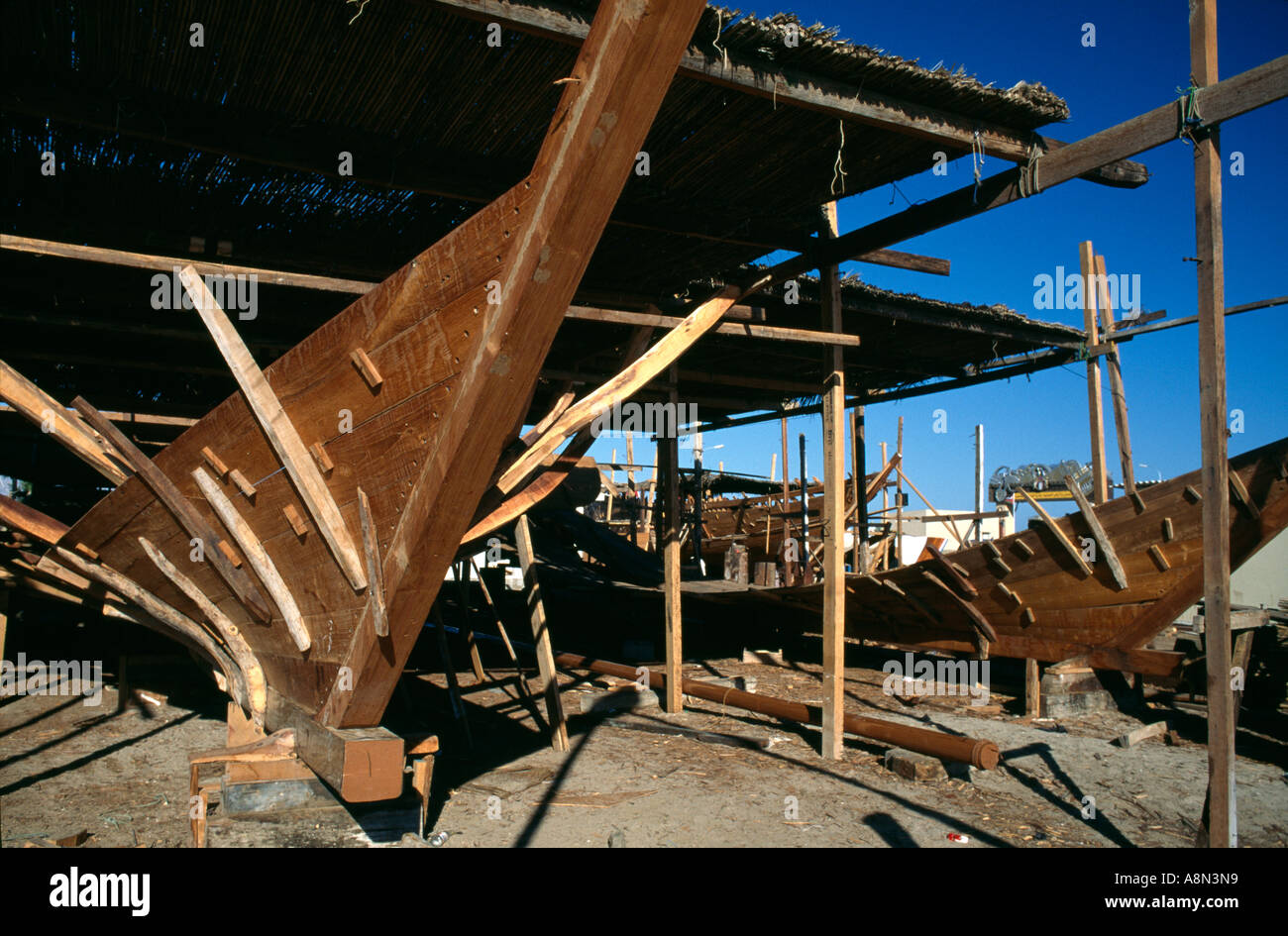 Dhow yard, Sur, Oman. Dhows are built by hand in the yard from wood ...