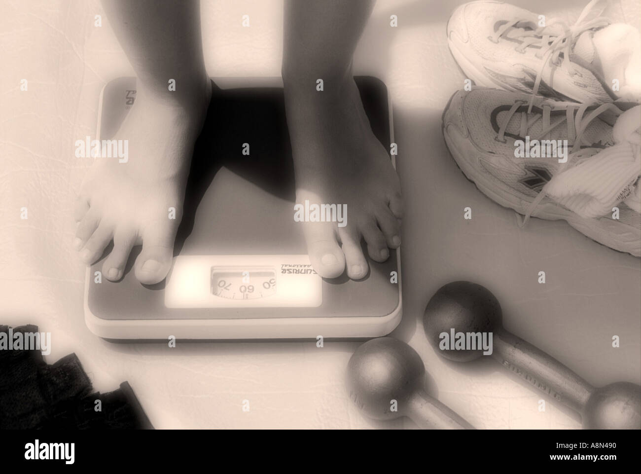 Woman s feet on a scale Stock Photo - Alamy