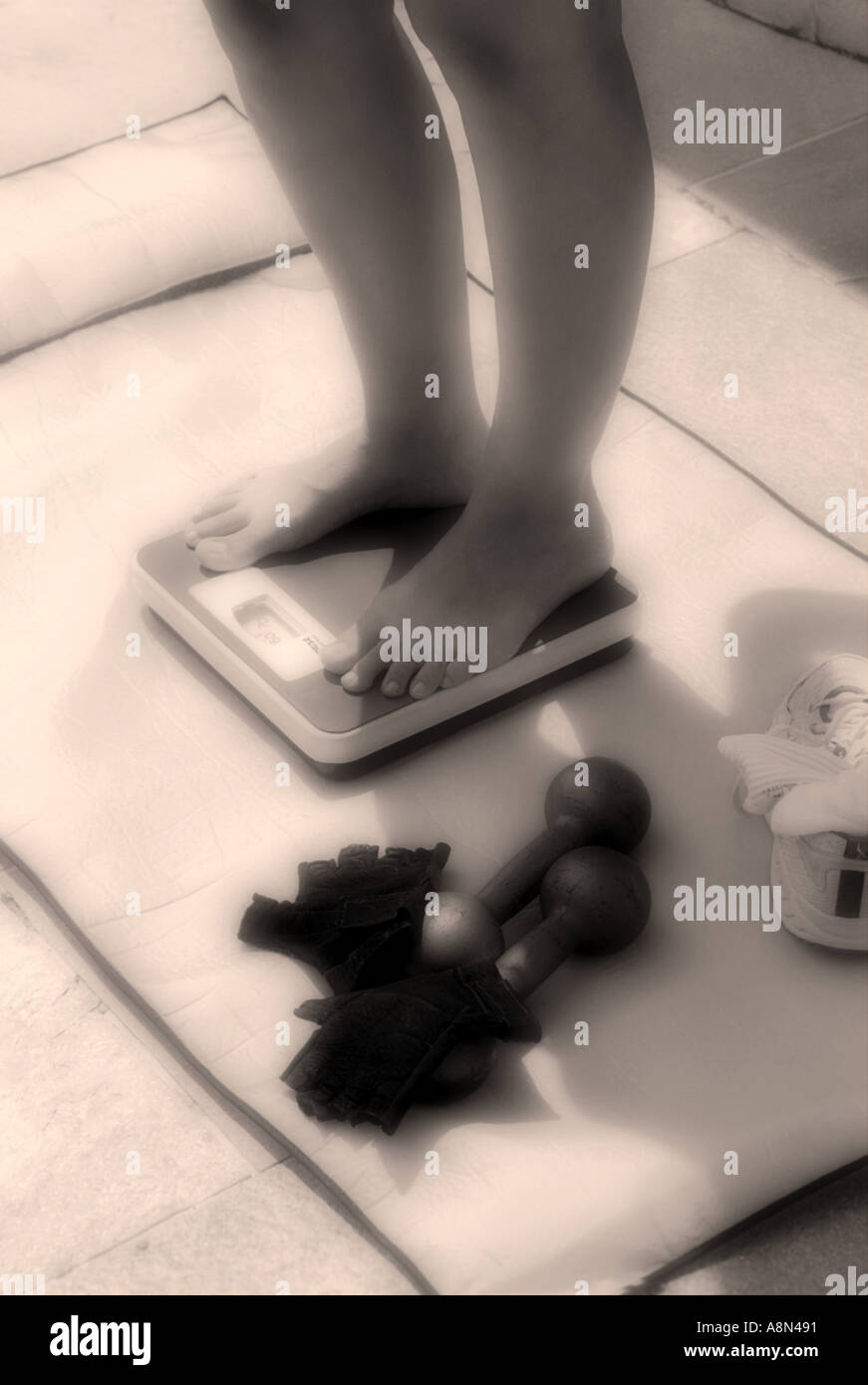 Woman s feet on a scale Stock Photo - Alamy