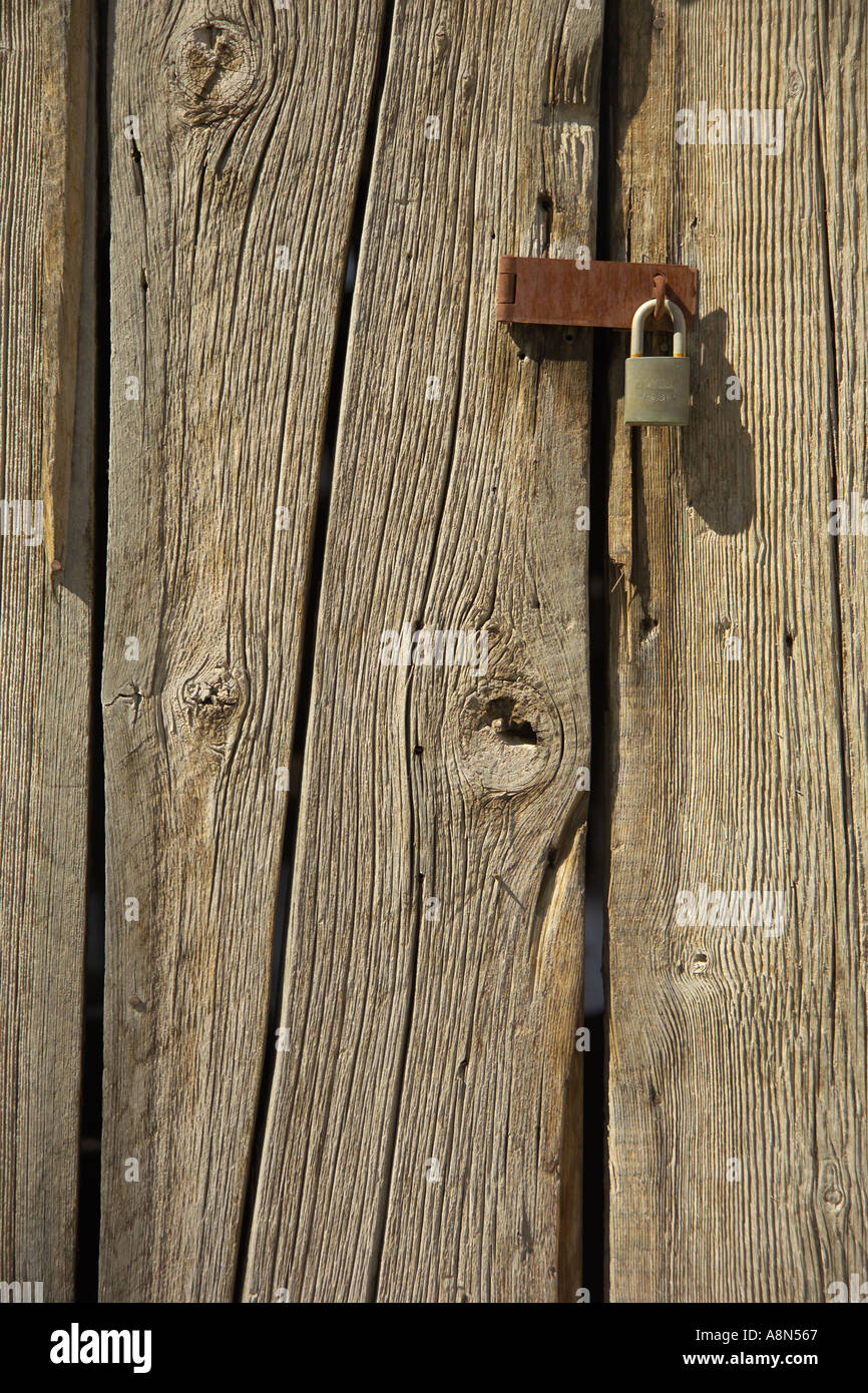 Padlock on a barn door Stock Photo - Alamy