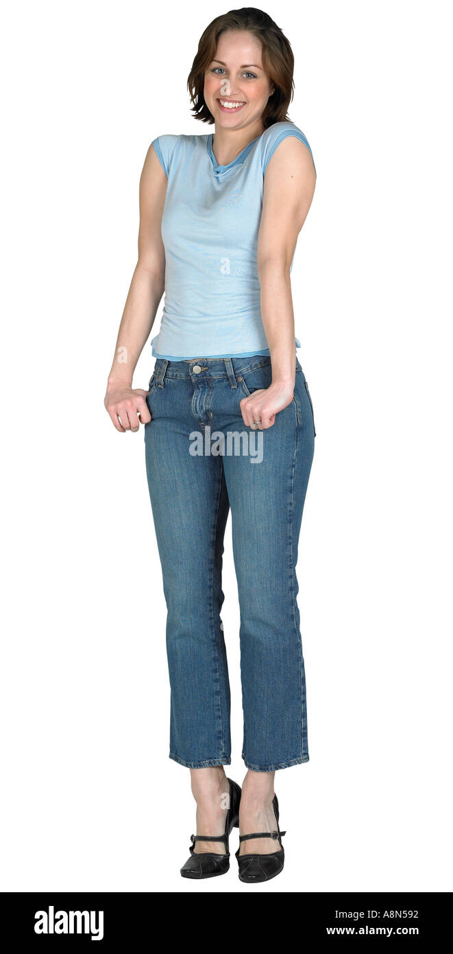 Woman with her thumbs in her pockets Stock Photo - Alamy