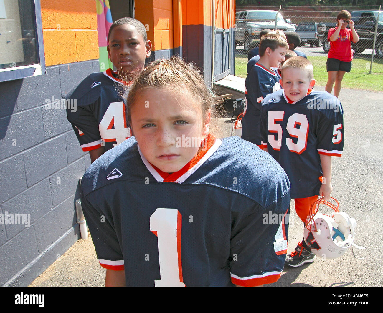 8 year old girl on boys team linebacker Stock Photo - Alamy
