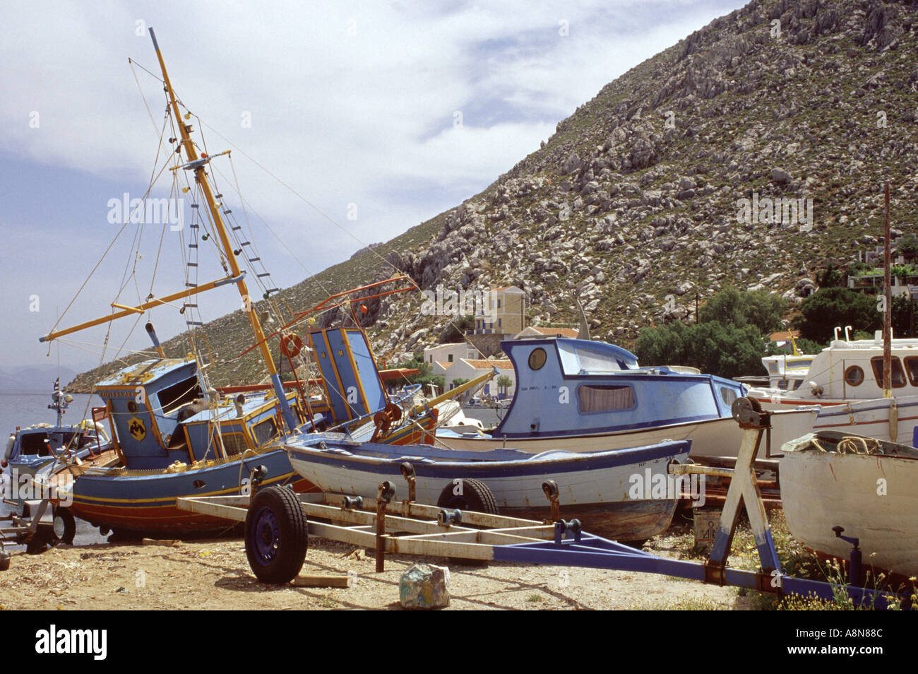 Boats at Pedi Bay Symi Island Greece Stock Photo - Alamy