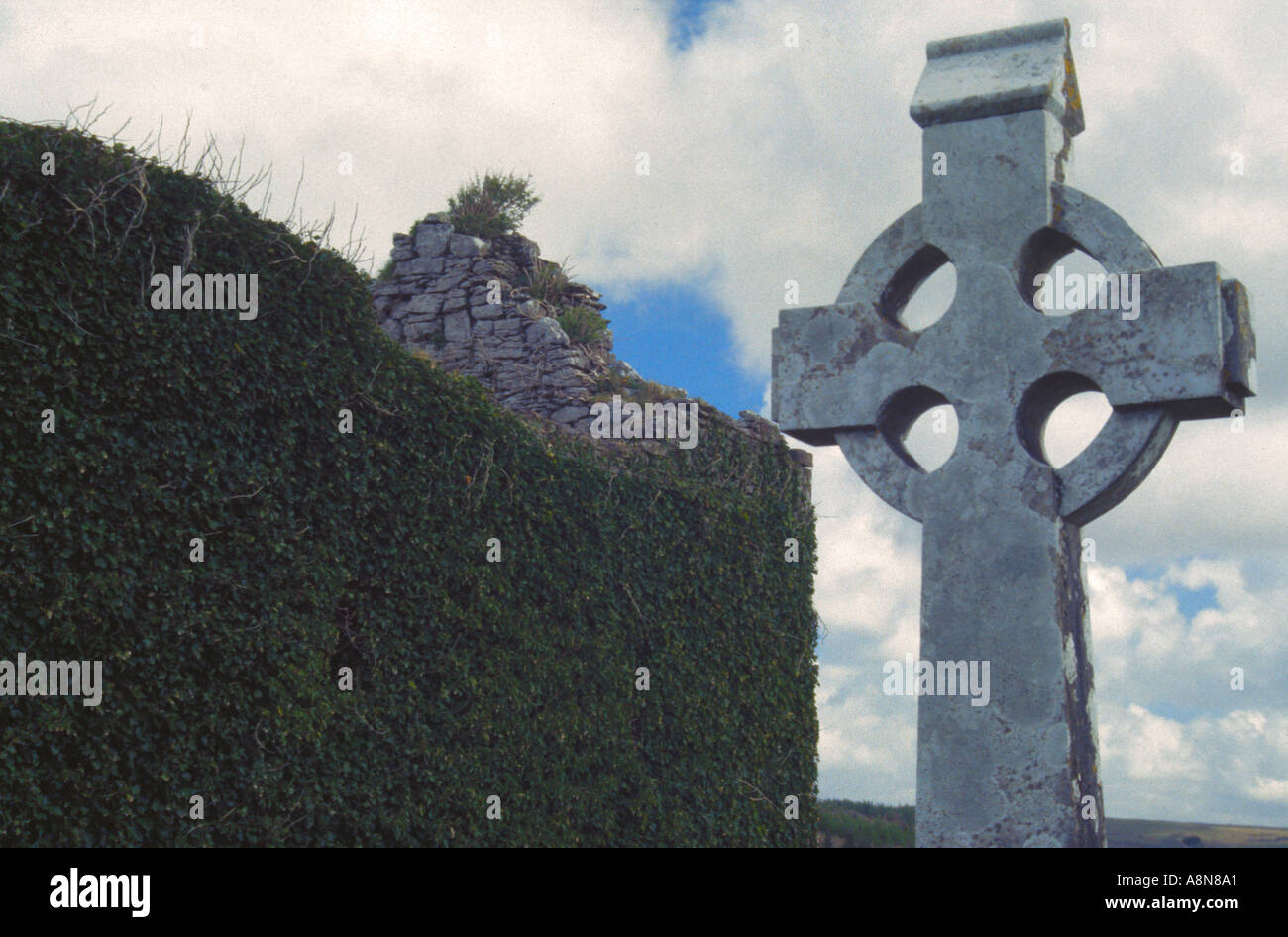 Celtic cross near the ruins of the 15th century Carron Church in Co ...