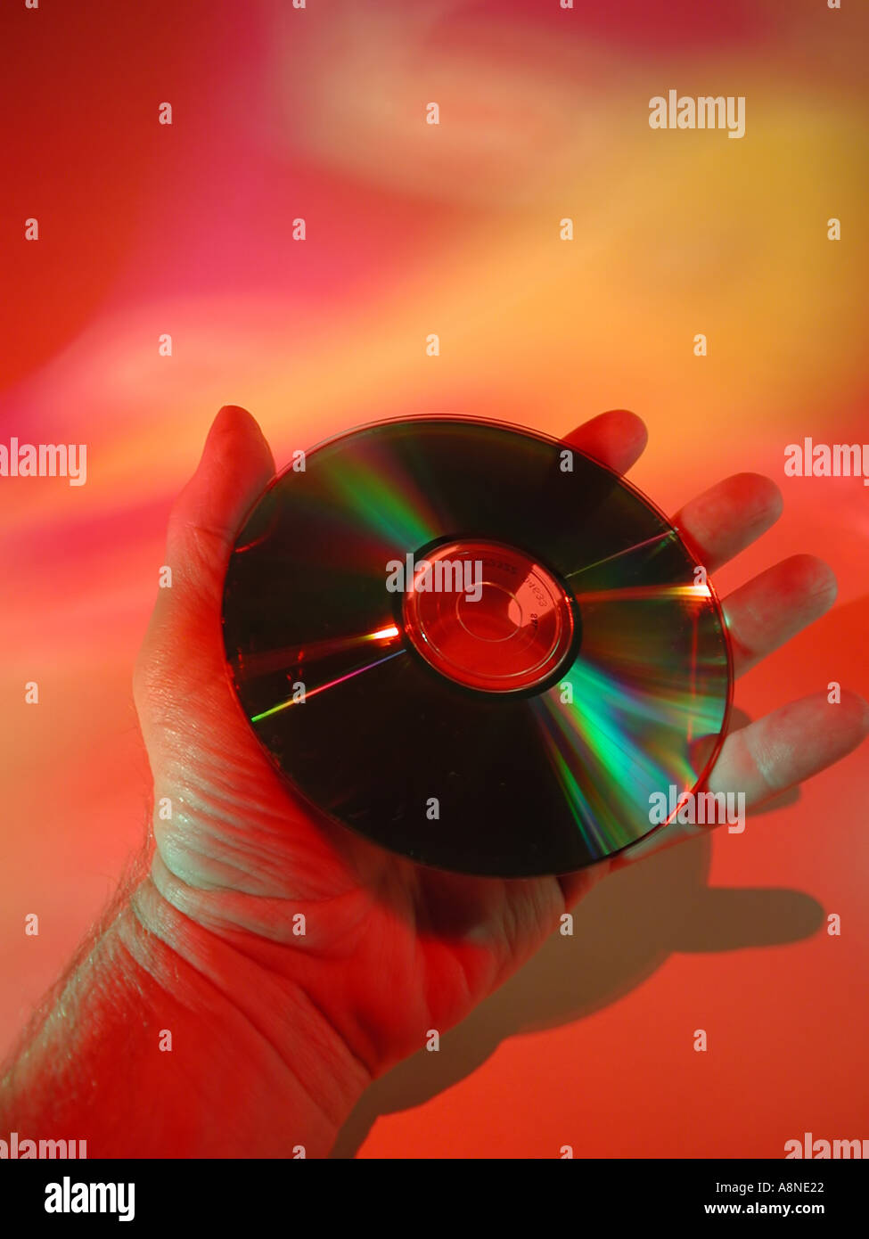 Hand holding CD ROM Stock Photo - Alamy