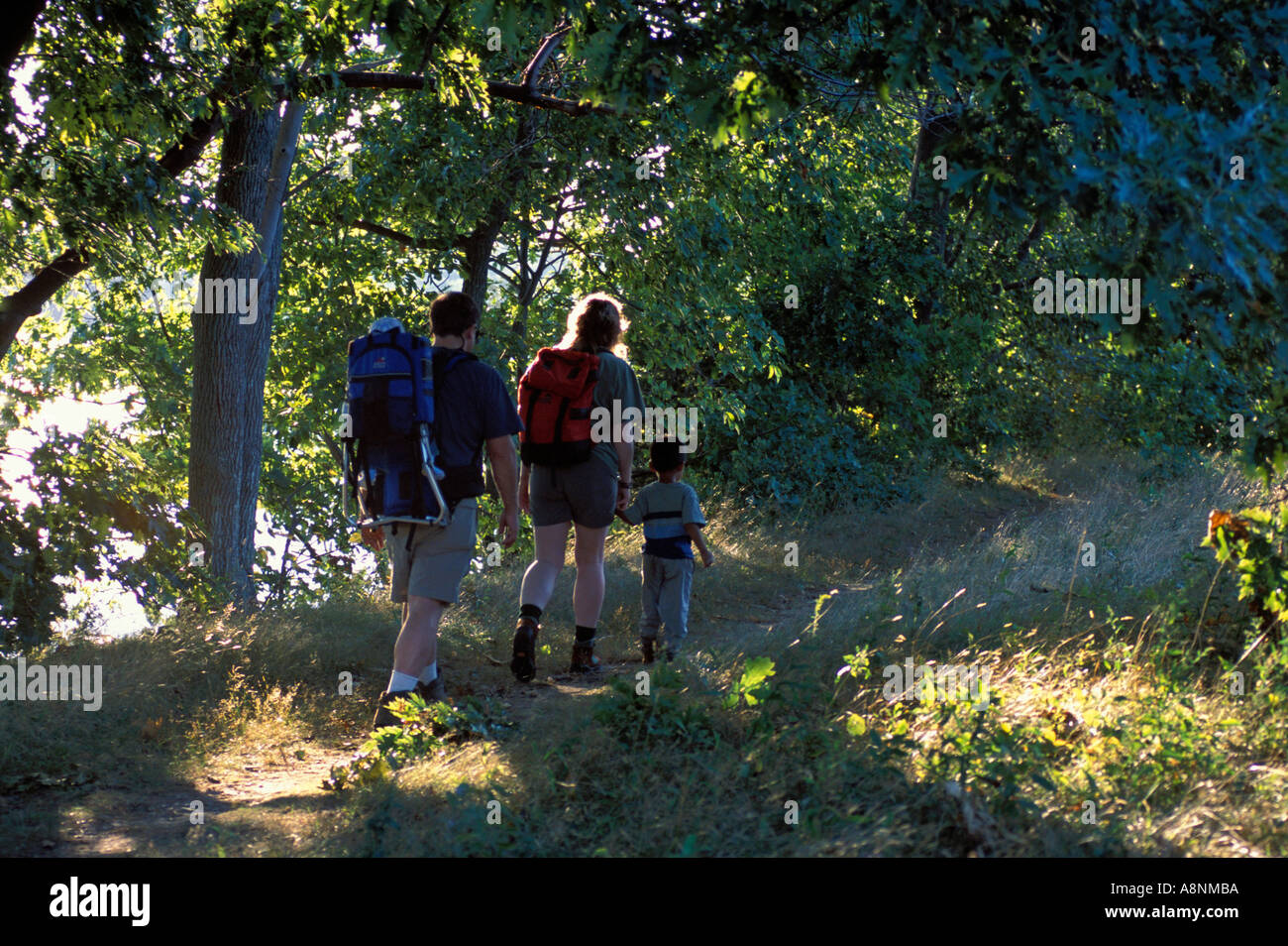 A family enjoys the trails at Adams Point a NH state wildlife reserve ...
