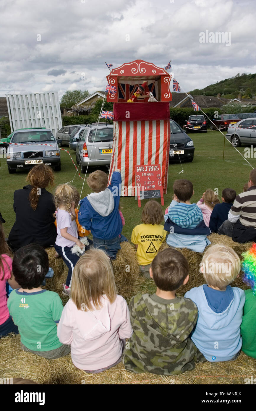 Children enjoying Punch and Judy show Mayday celebrations 2007 ...