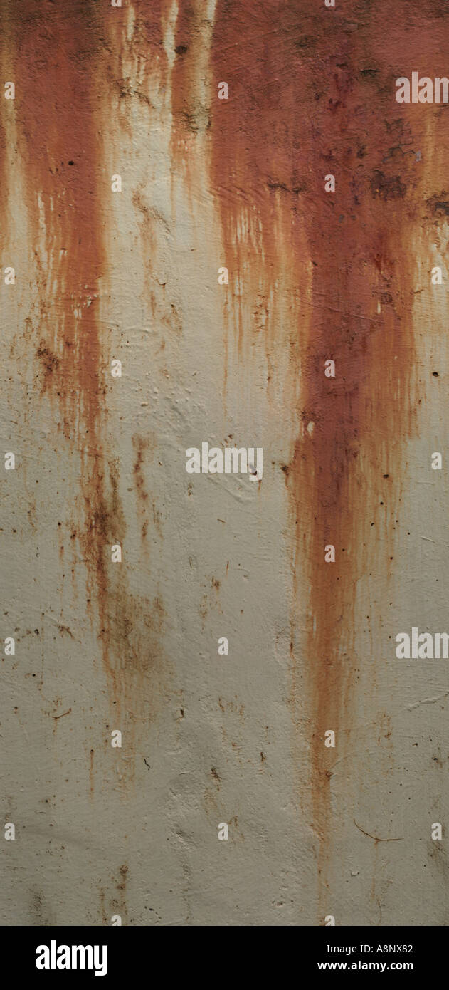 rust stains down cream colored concrete Stock Photo - Alamy
