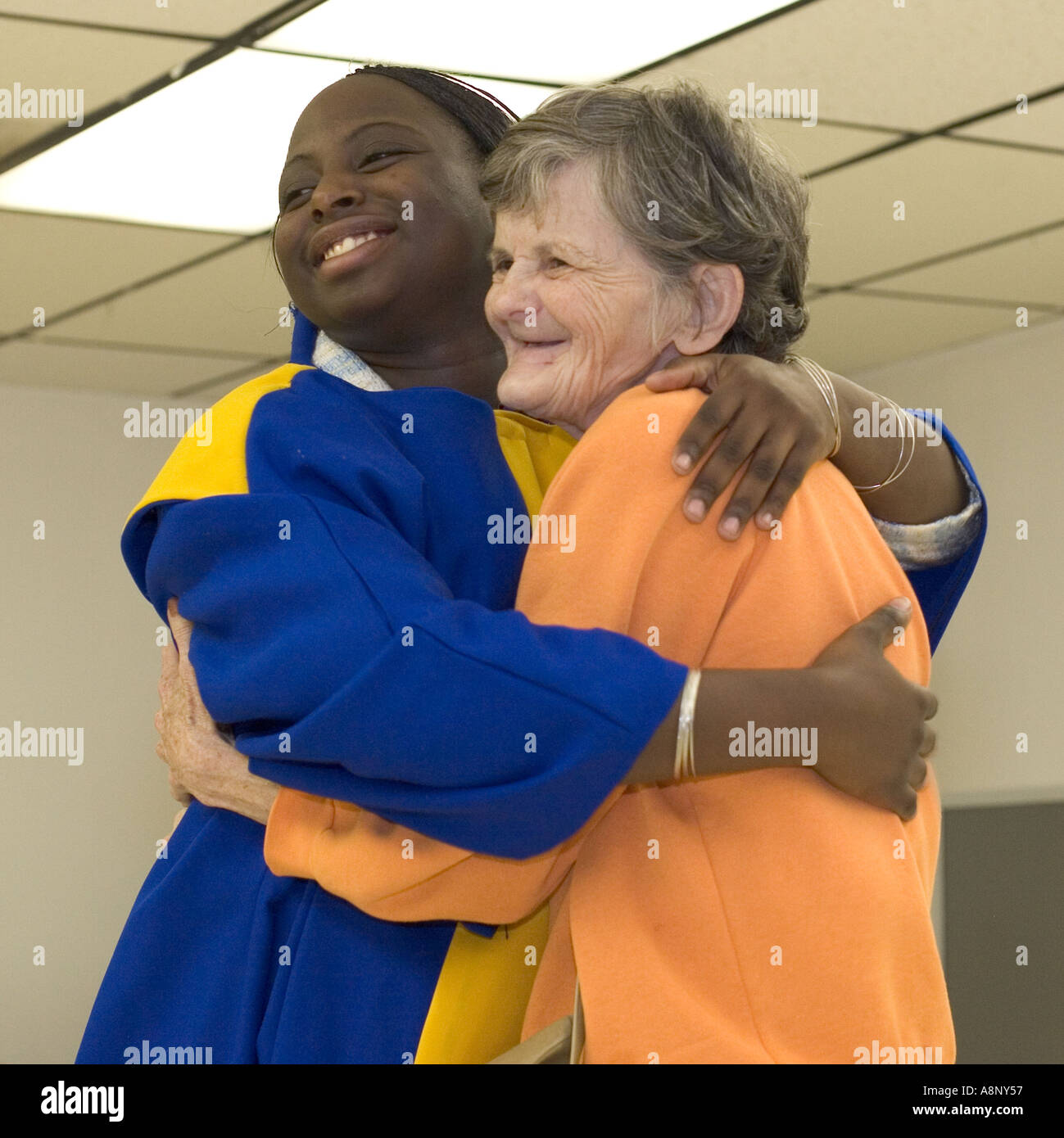 Handicap handicapped hug white black african american hi-res stock ...
