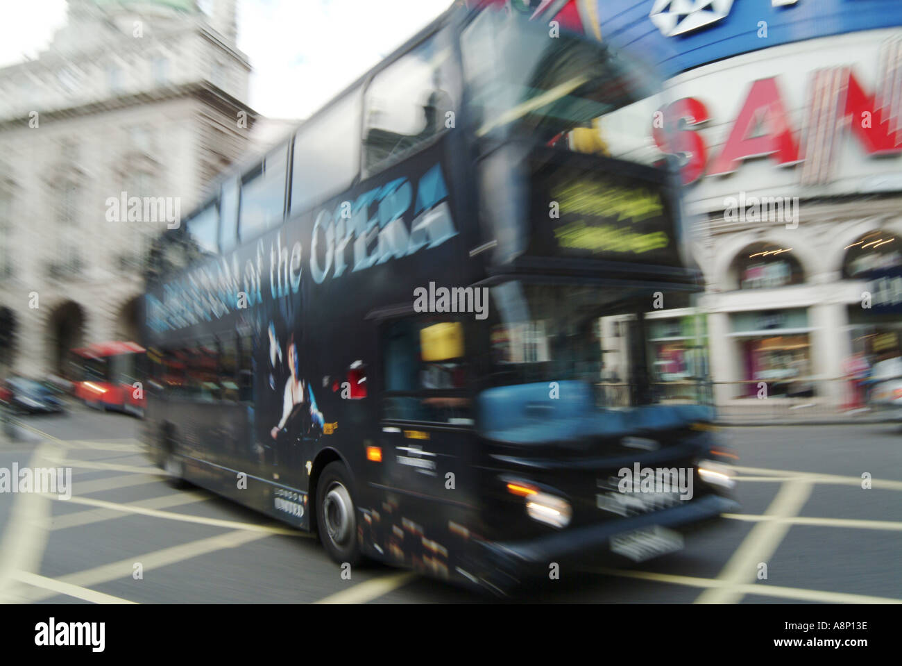 A double decker London bus passing Piccadilly Circus Stock Photo - Alamy