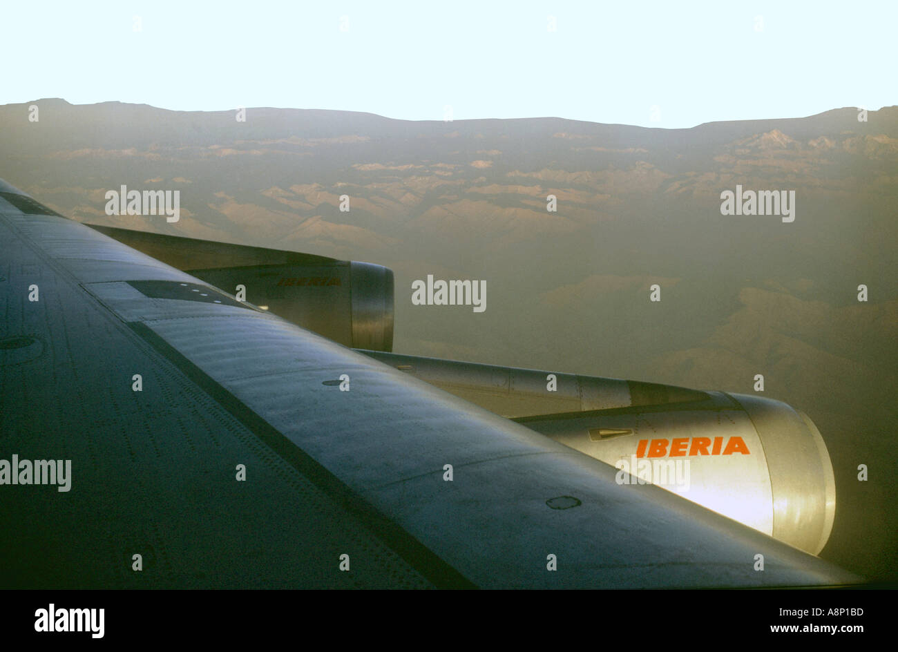 Wing from passenger cabin of flight across the Andes by jet plane on ...