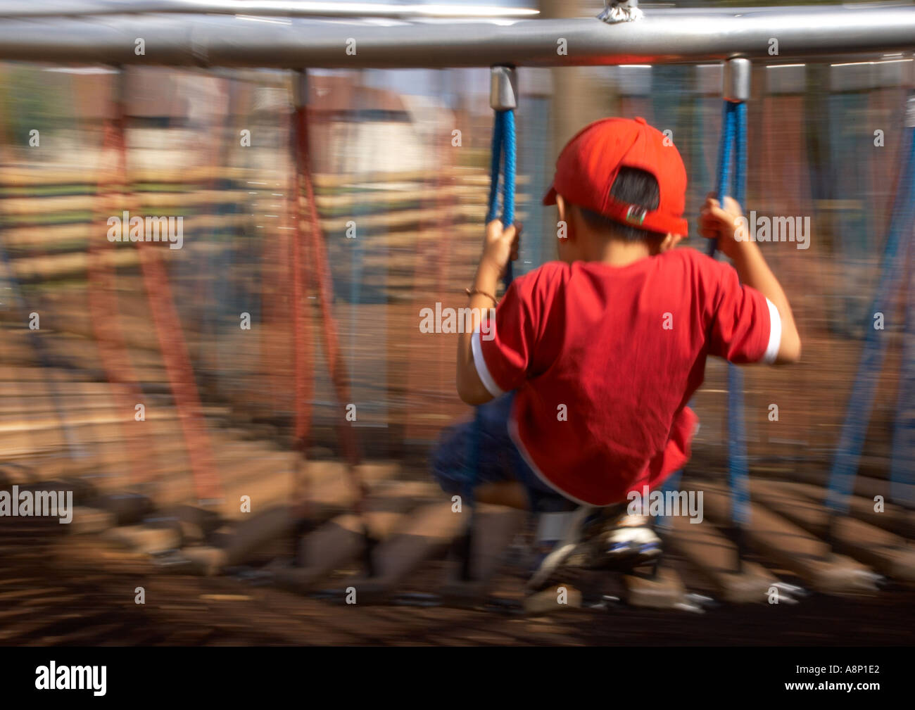 Child at Play Speeding on Roundabout Stock Photo - Alamy