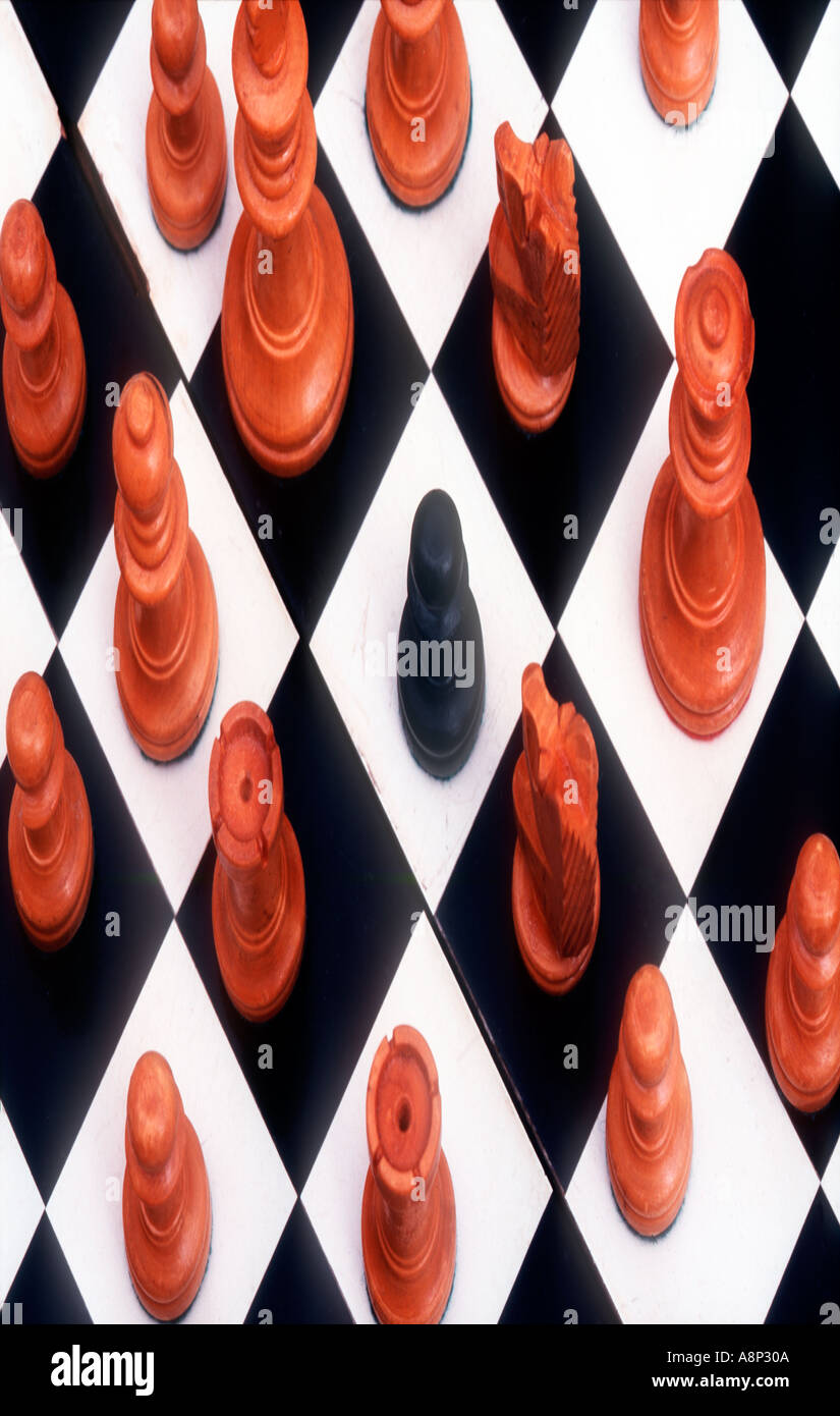 Stylised view of chess set with black prawn surrounded by white pieces ...