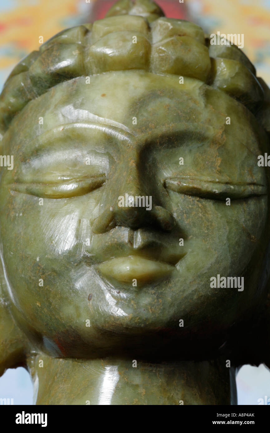 Close up green jade Buddha head Stock Photo - Alamy
