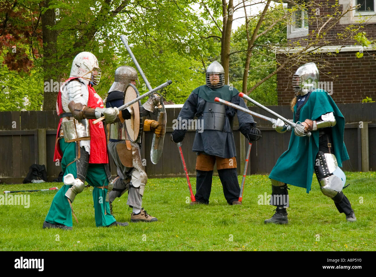 Medieval Re Enactors practice sword fighting Stock Photo - Alamy